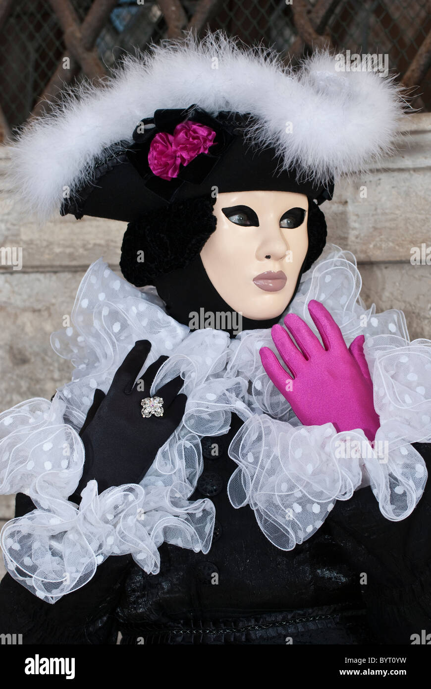 Single Venetian mask during carnival in disguise posing near a marble ...