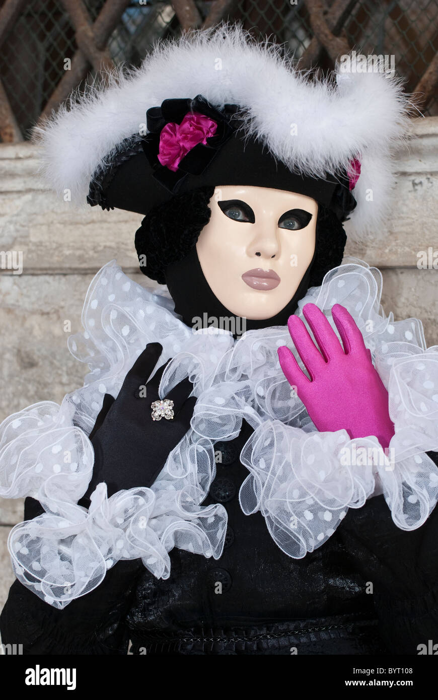 Single Venetian mask during carnival in disguise posing near a marble ...
