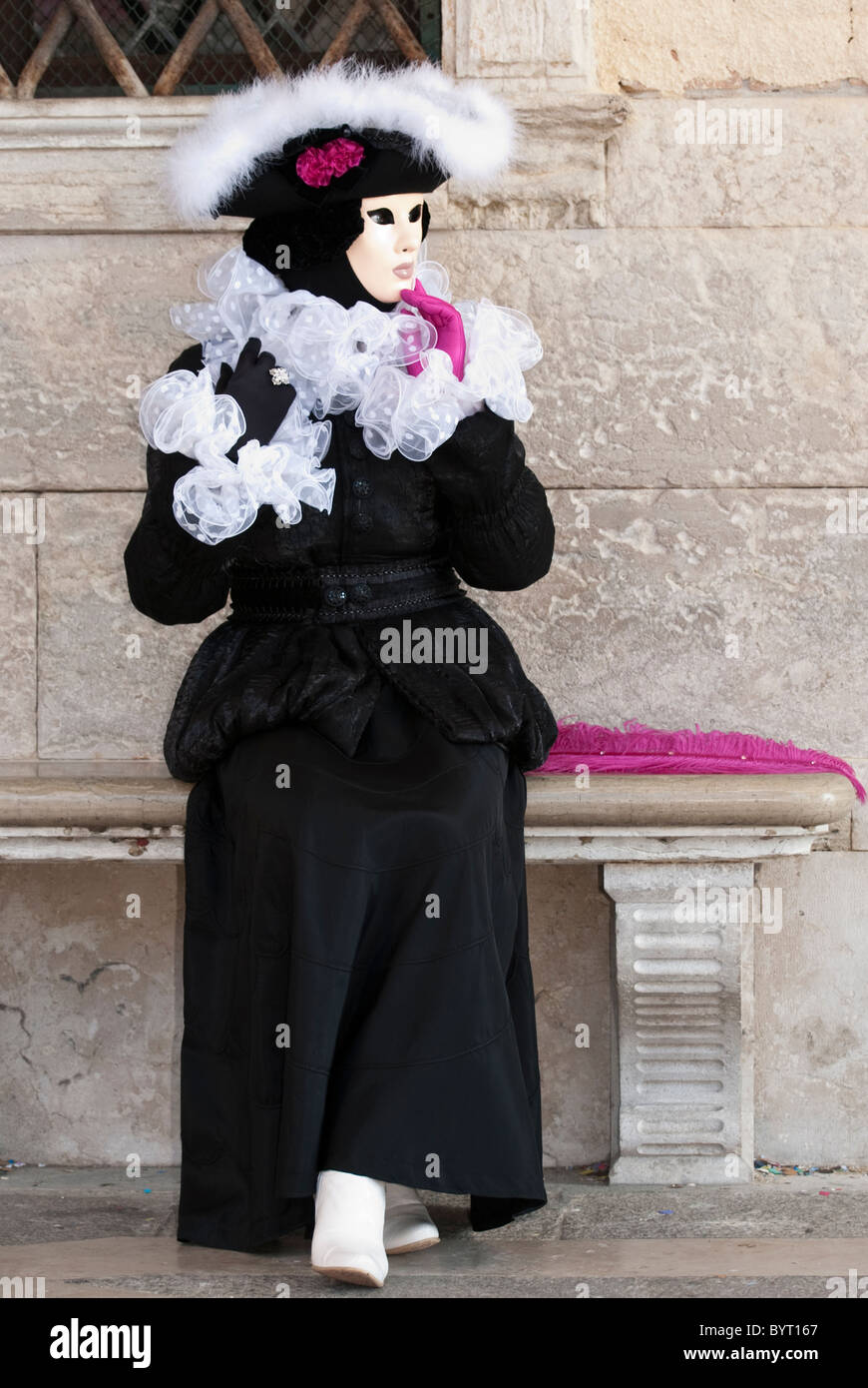 Single Venetian mask during carnival in disguise posing near a marble ...