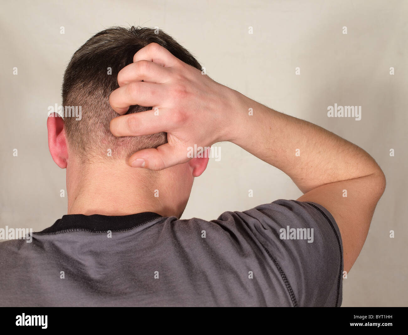 The man's hand scratches a short-haired nape Stock Photo - Alamy