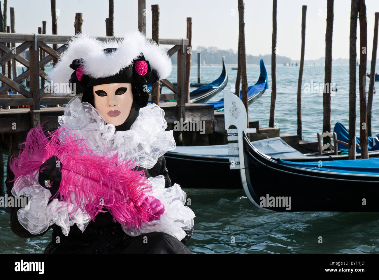 Single Venetian mask during carnival in disguise sitting on the dock ...