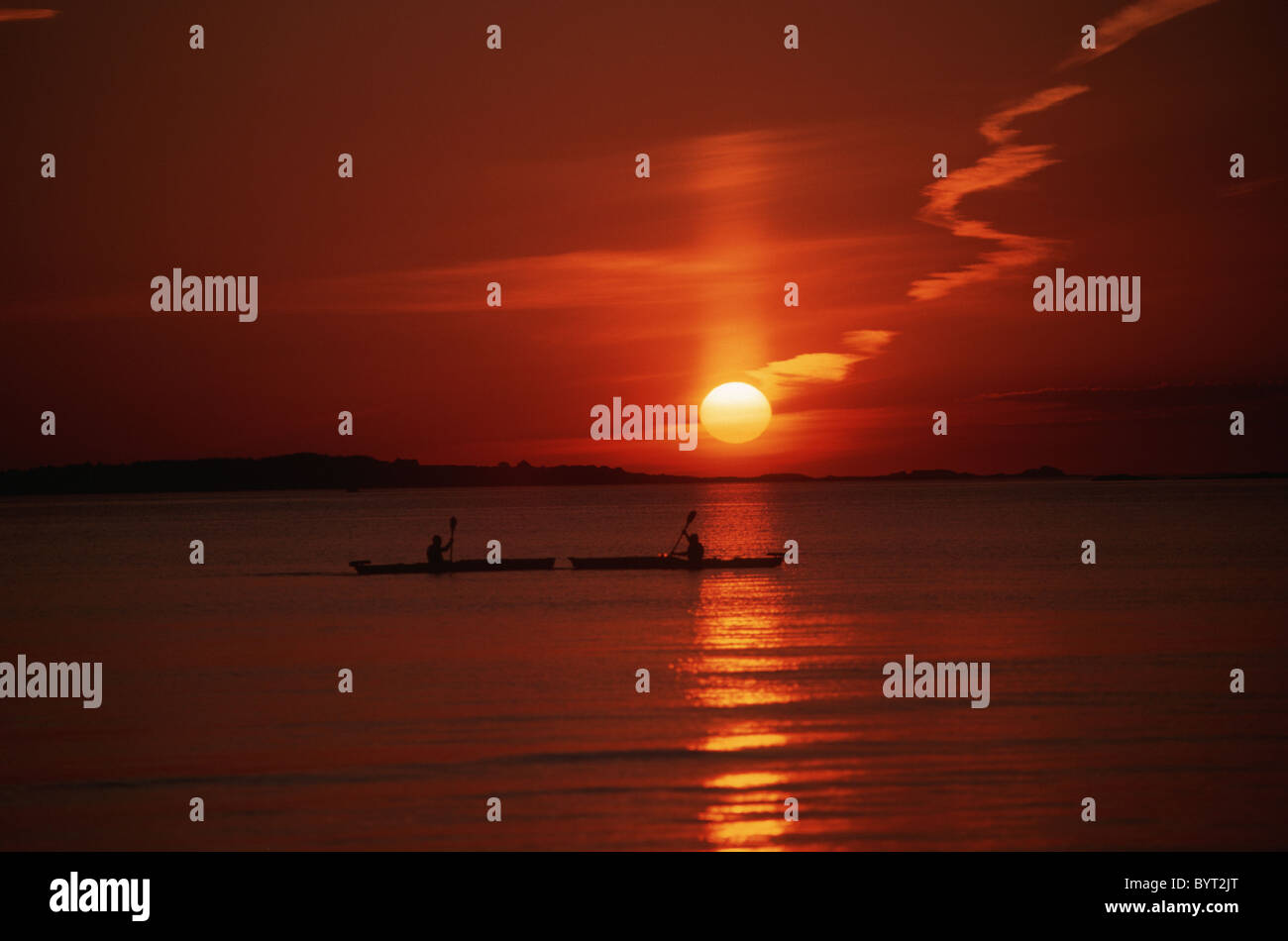 Kayak Paddlers in red sunset, Norway the land of the midnight sun Stock ...