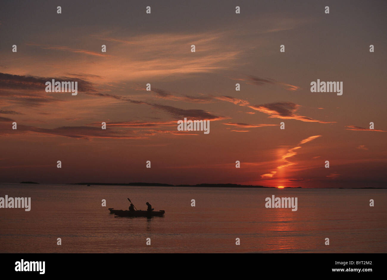 Kayak Paddlers in red sunset, Norway the land of the midnight sun Stock ...