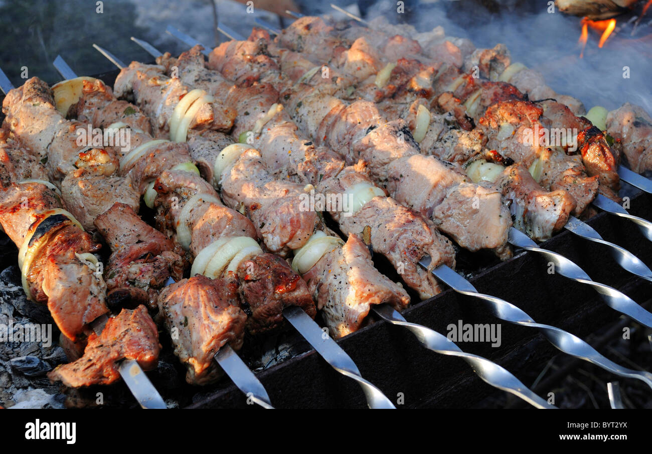 shish kebab prepares on the fire Stock Photo - Alamy