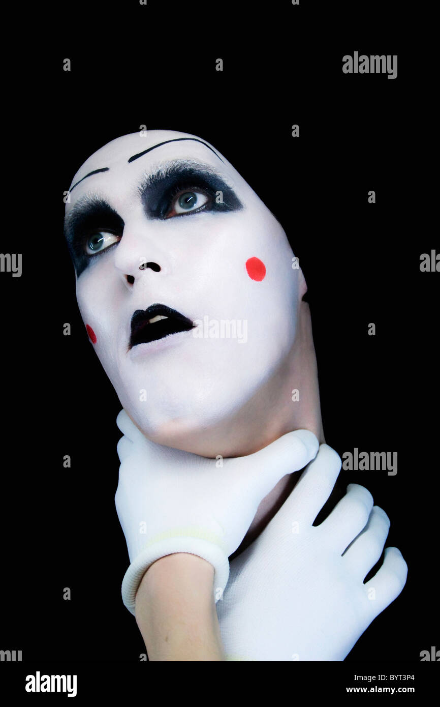 mime with hands on a neck Stock Photo - Alamy