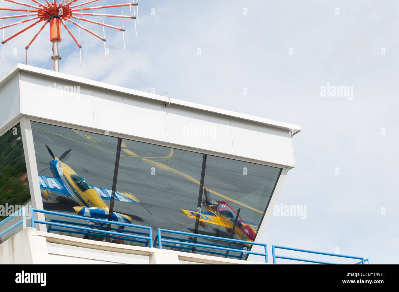Airport traffic tower with plane reflection Stock Photo - Alamy