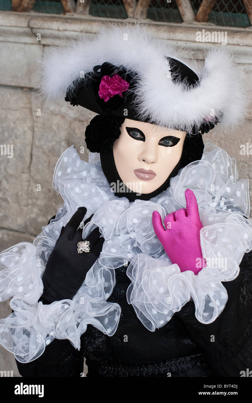 Single Venetian mask during carnival in disguise posing near a marble ...