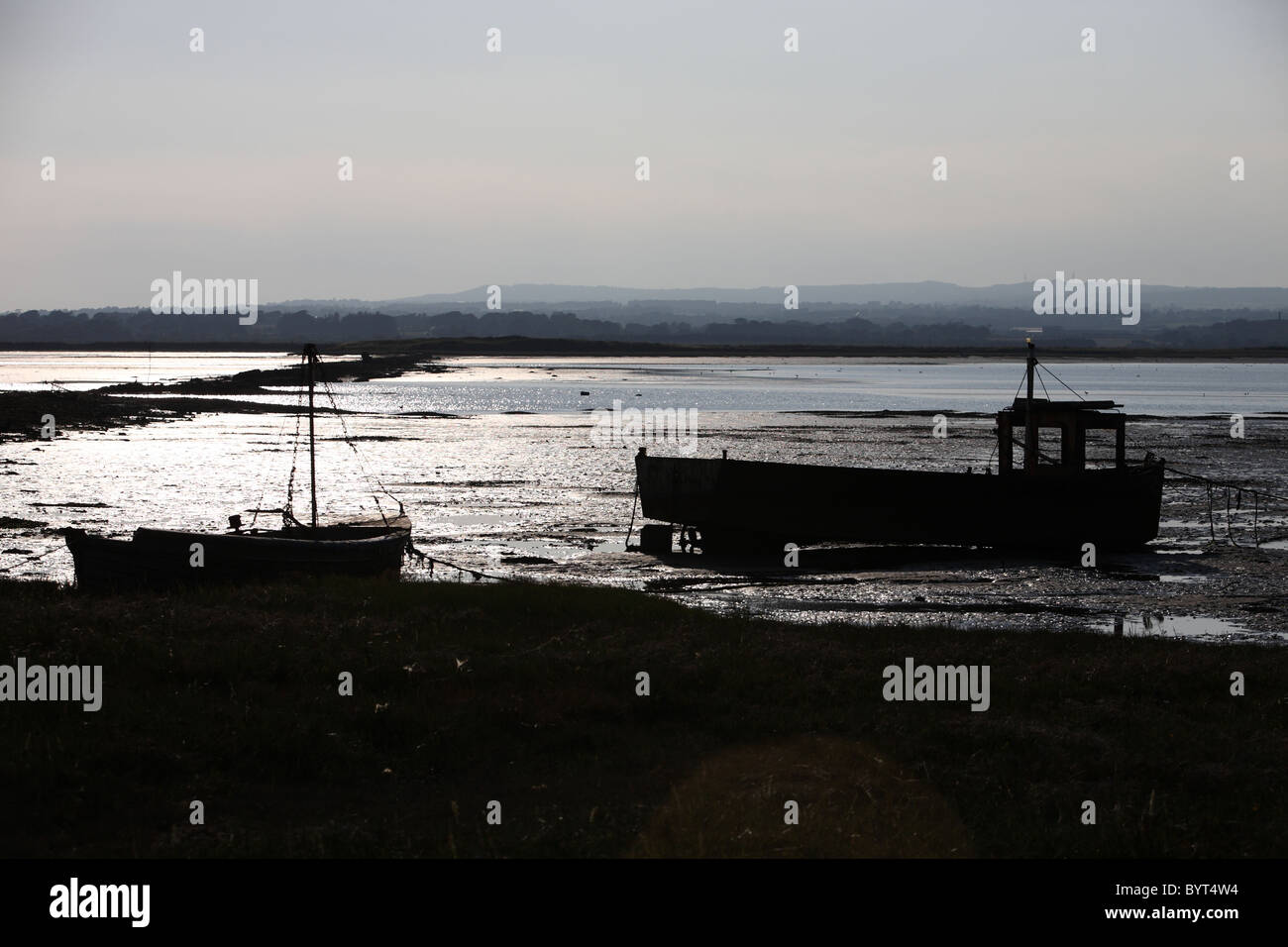 Low tide beach with white boats hi-res stock photography and images - Alamy