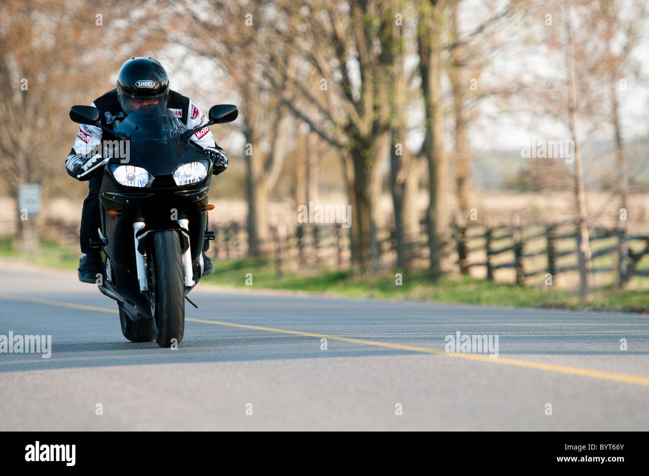 Man speeding on a motorbike Stock Photo - Alamy