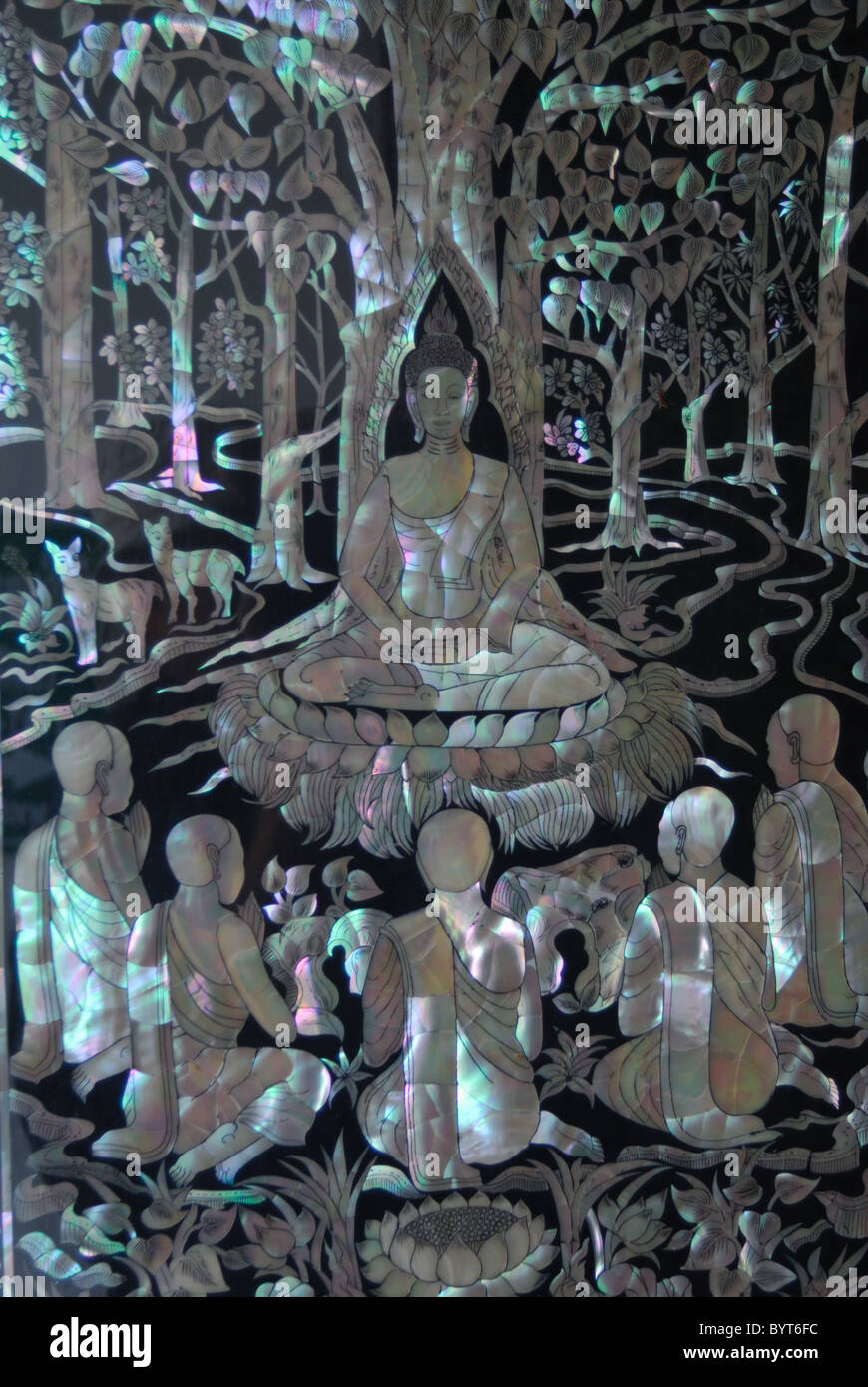 A Buddha scene on the door of the main temple at Phitsanulok, Thailand ...