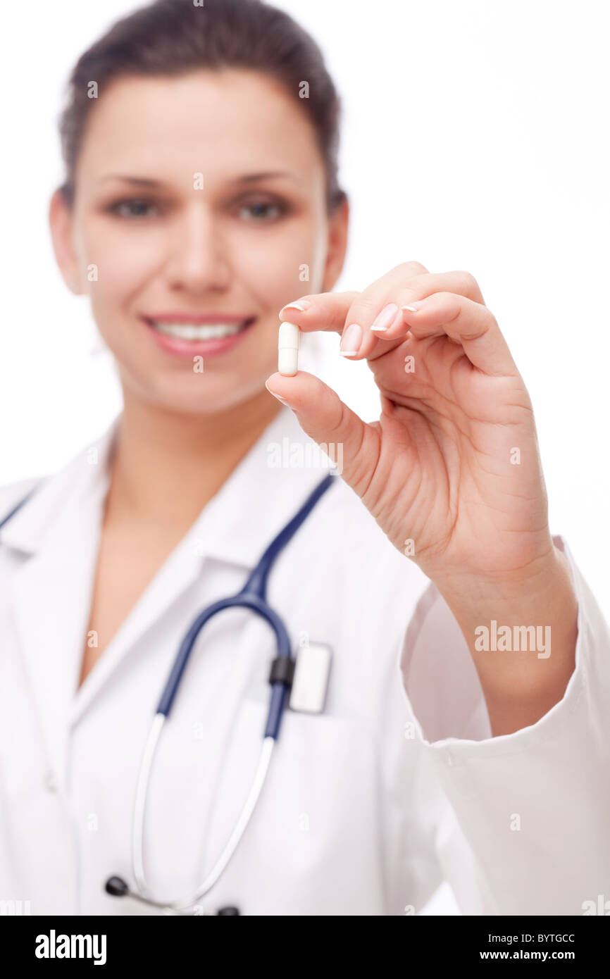 Doctor giving a pill. Hand with pill is front plan Stock Photo - Alamy