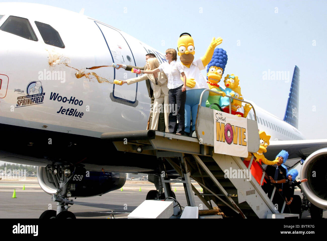 Bart, Marge, Maggie, Homer, and Lisa Simpson with Denise Sirkot of ...