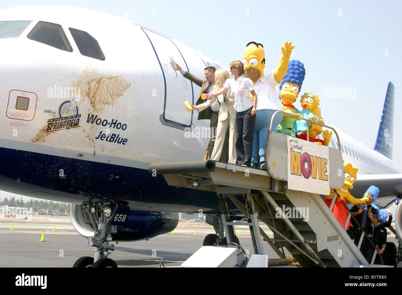 Bart, Marge, Maggie, Homer, and Lisa Simpson with Denise Sirkot of ...