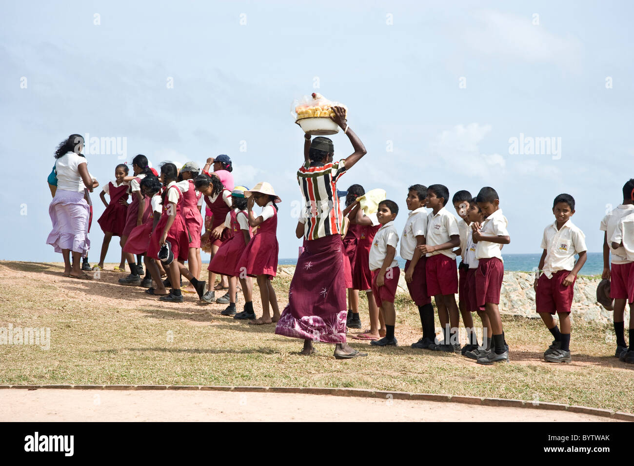 queue of school children on cliff Stock Photo - Alamy