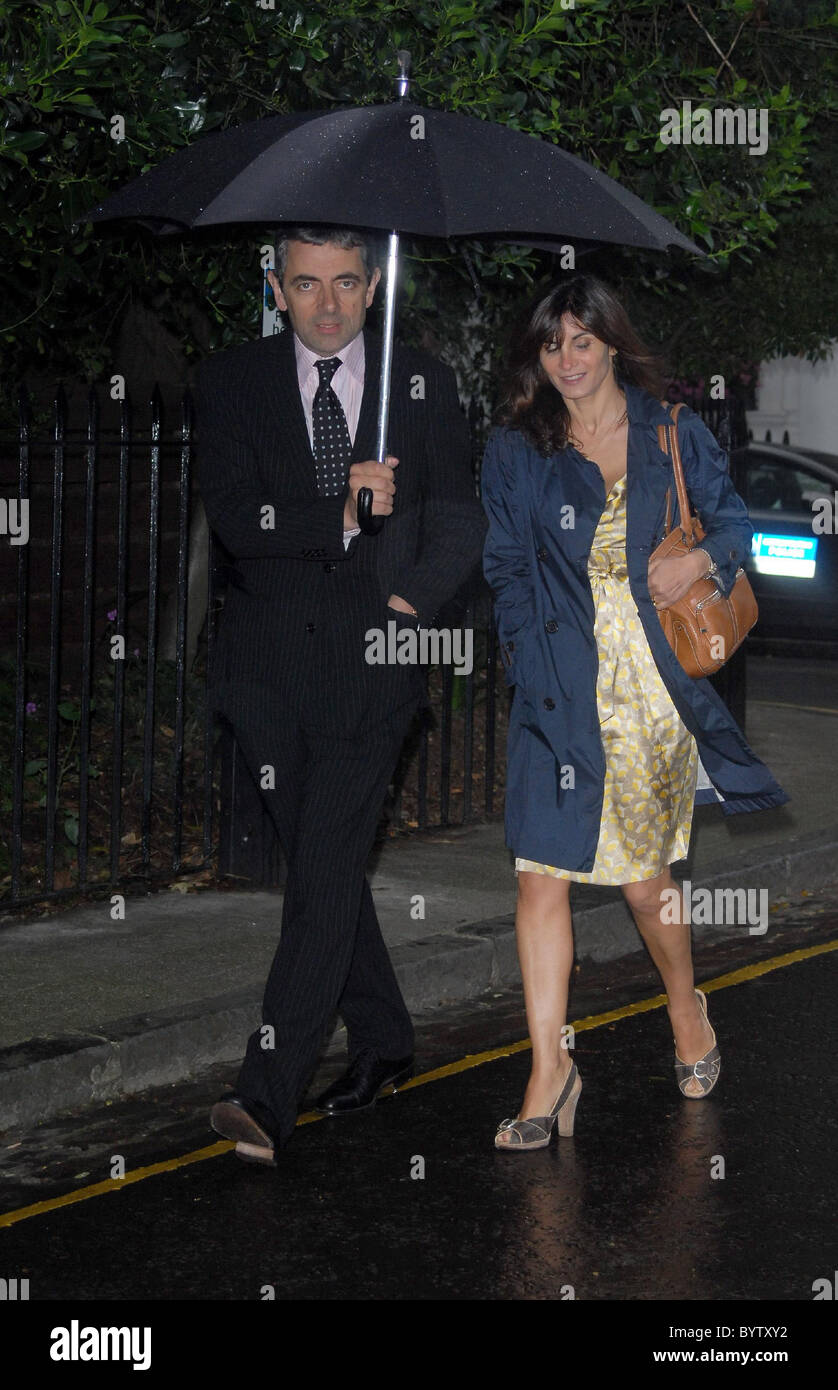 Rowan Atkinson and wife Sunetra Sastry arrive at Sir David Frosts ...