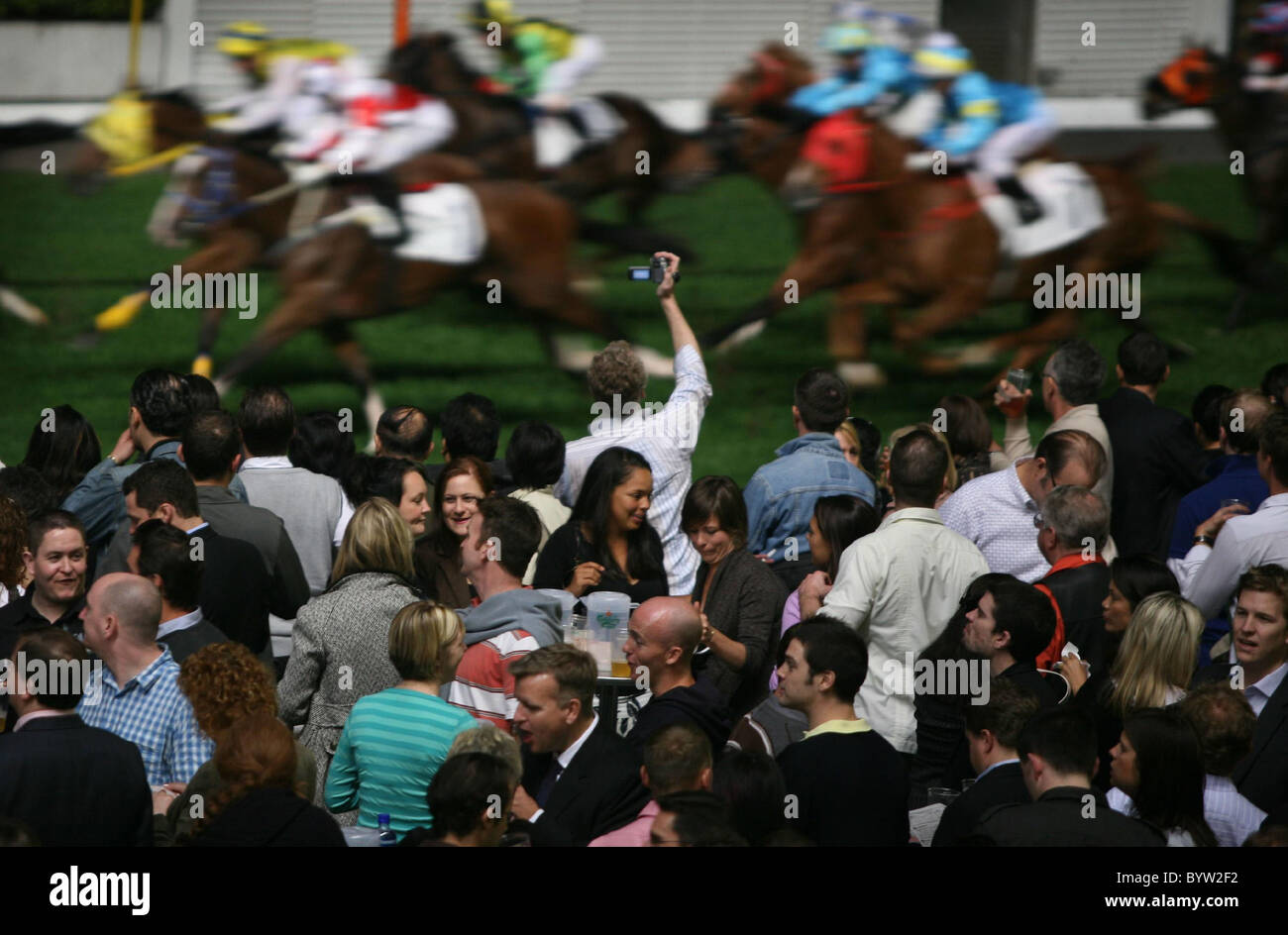 * ONE HORSE RACE The audience cheers on the horses at Hong Kong's Happy ...