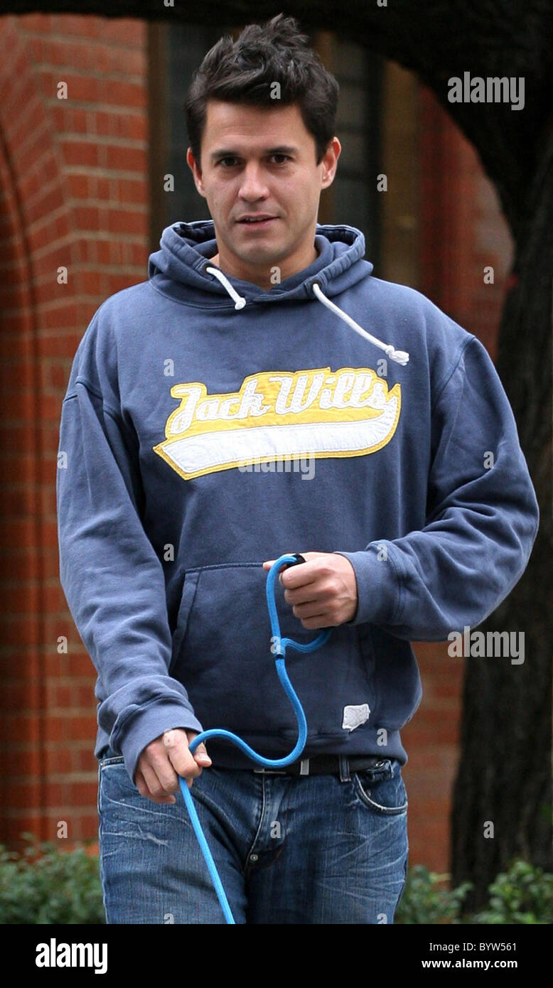 Jeremy Edwards gives a smile to the photographer as he walks his dog in ...