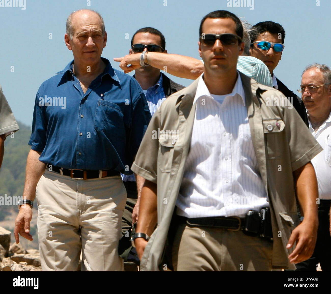 Bodyguards surround Israeli Prime Minister Ehud Olmert during a visit ...