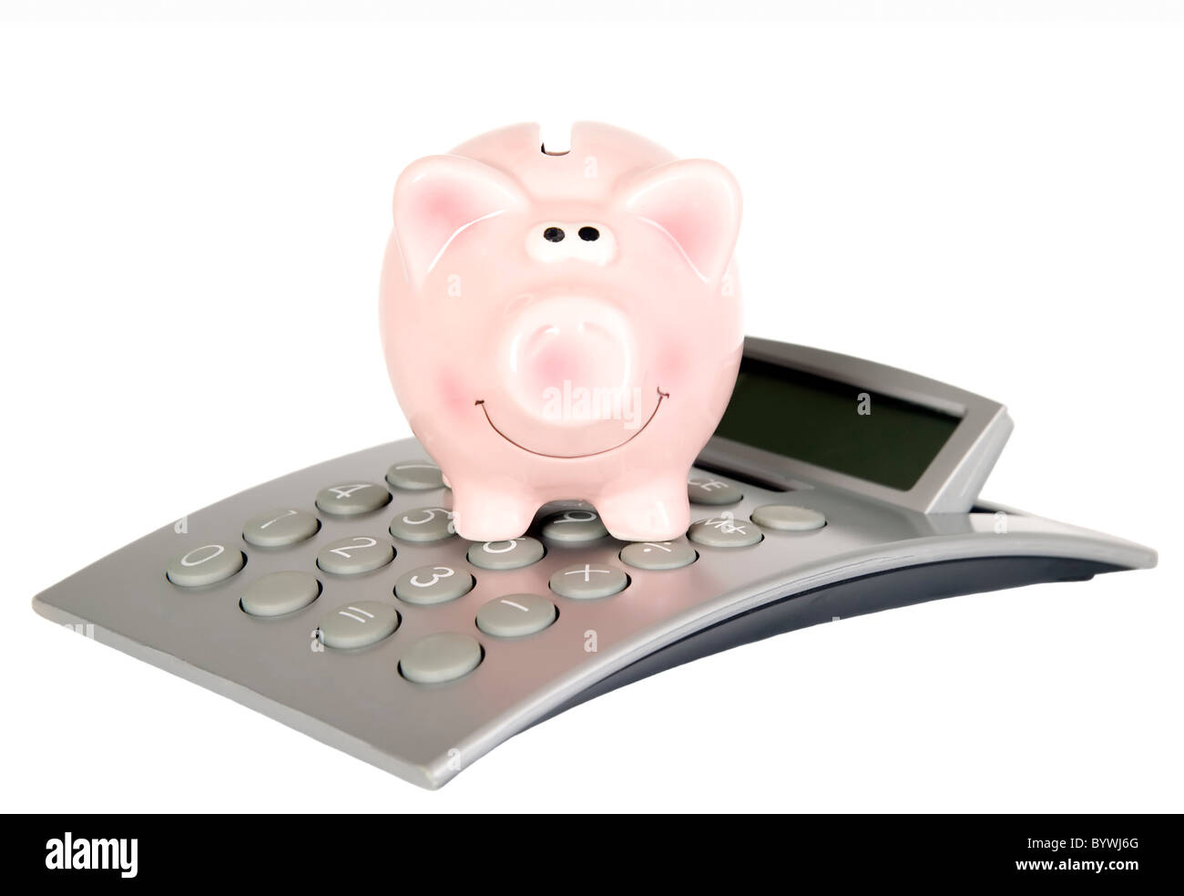Saving pig is on calculator, finance concept Stock Photo - Alamy