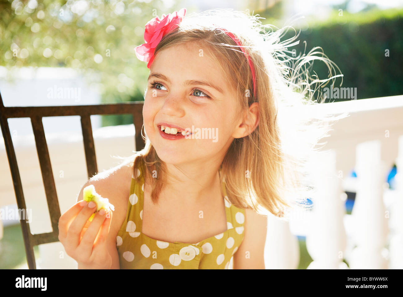 Girl eating fresh fruit Stock Photo - Alamy