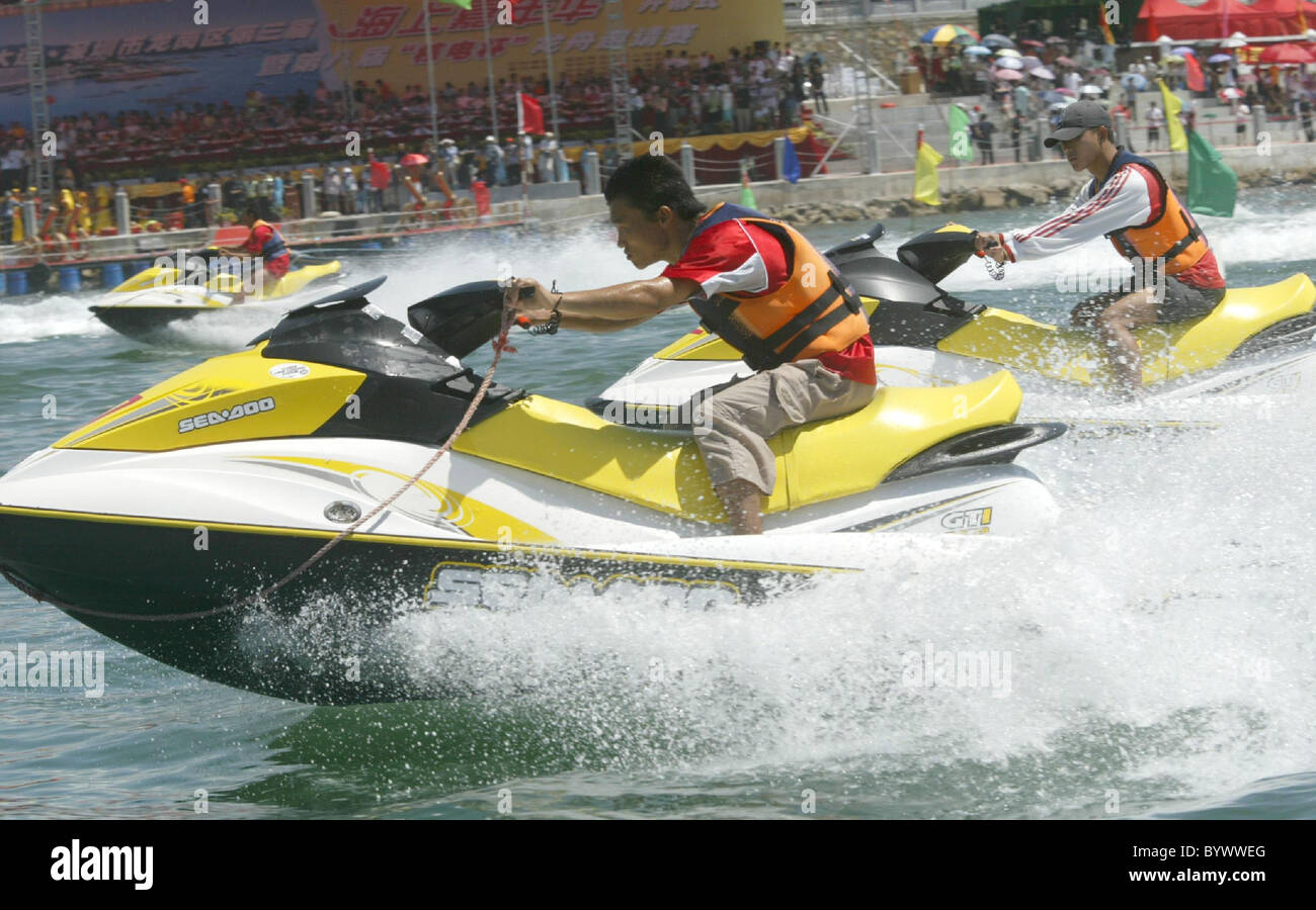 * BEACH PARTY Speed boats, surfers and jet skiers hit the waves for a ...