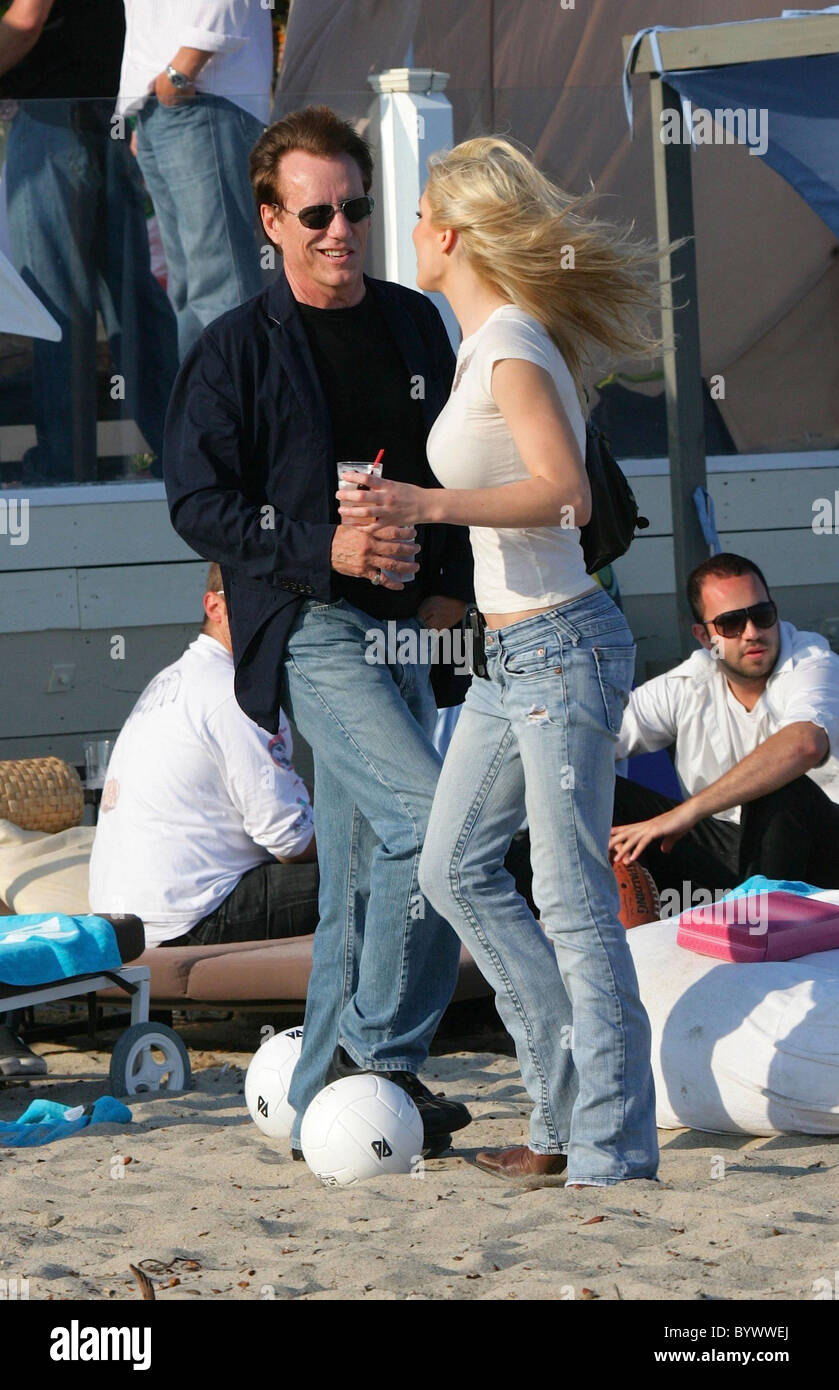 James Woods hangs out with friends at a beach party. Woods is currently ...