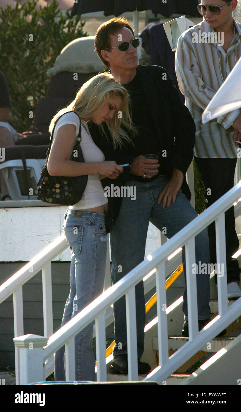 James Woods hangs out with friends at a beach party. Woods is currently ...