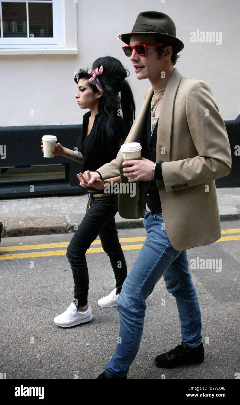 Amy Winehouse and husband Blake Fielder Civil arrive at the airport ...