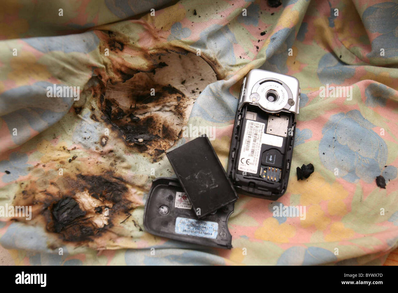 * HEATED CONVERSATION A man shows off a gory gash where his mobile ...