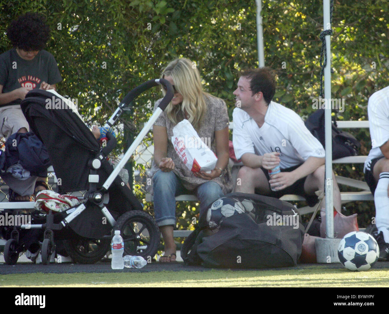 Declan Donelly sits with friends after playing football for Robbie ...