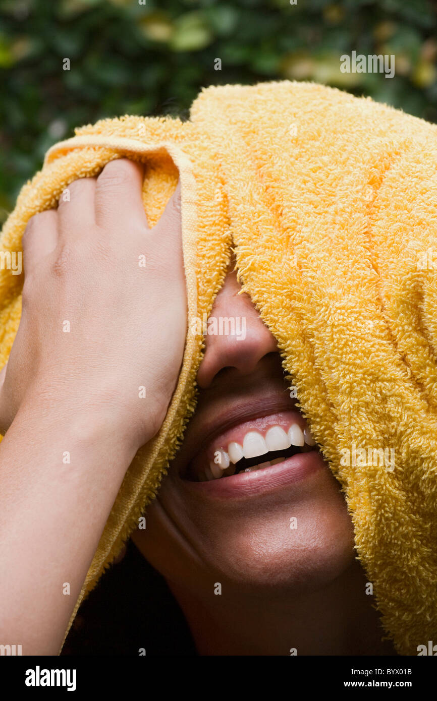 Woman wiping head outdoors hi-res stock photography and images - Alamy