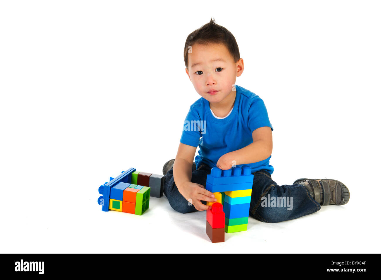 Physically handicapped little boy with one hand is playing with ...