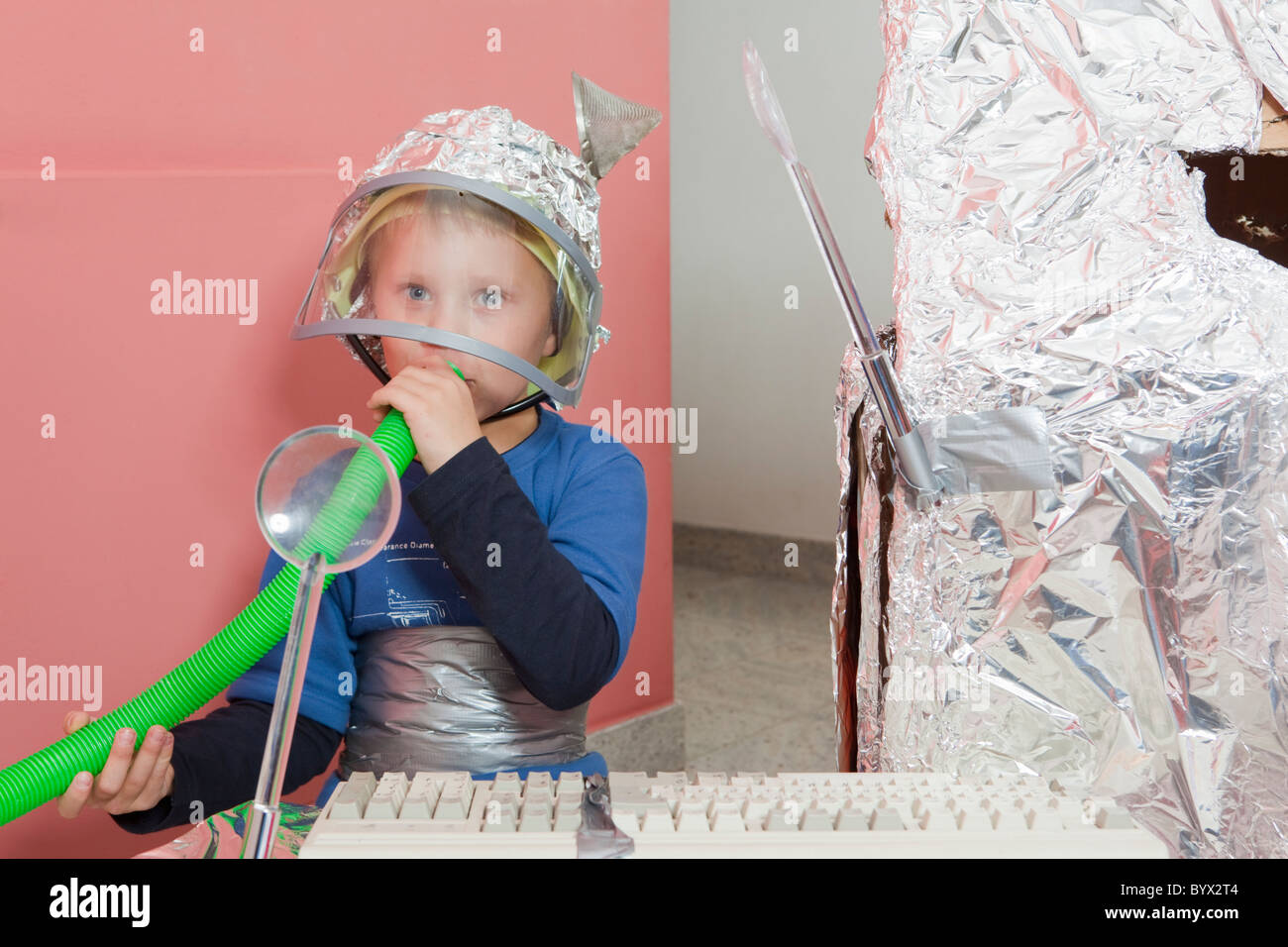 Boy with self constructed space house Stock Photo - Alamy