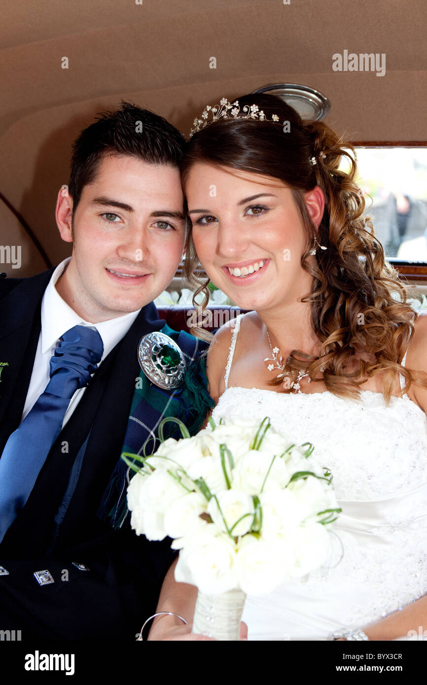 Bride and groom leaving for reception Stock Photo - Alamy