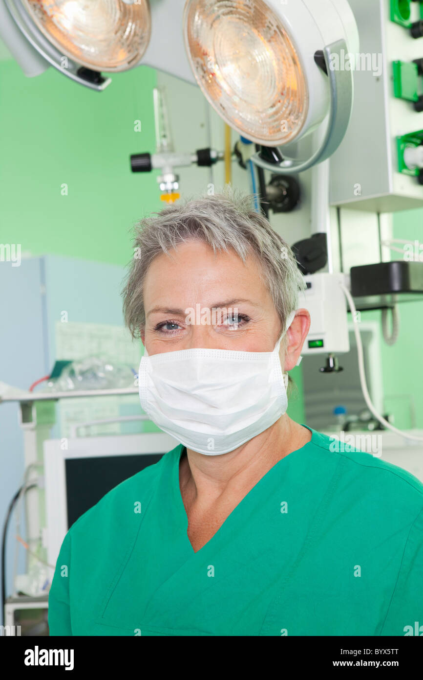 Female doctor with scrub and op mask Stock Photo - Alamy