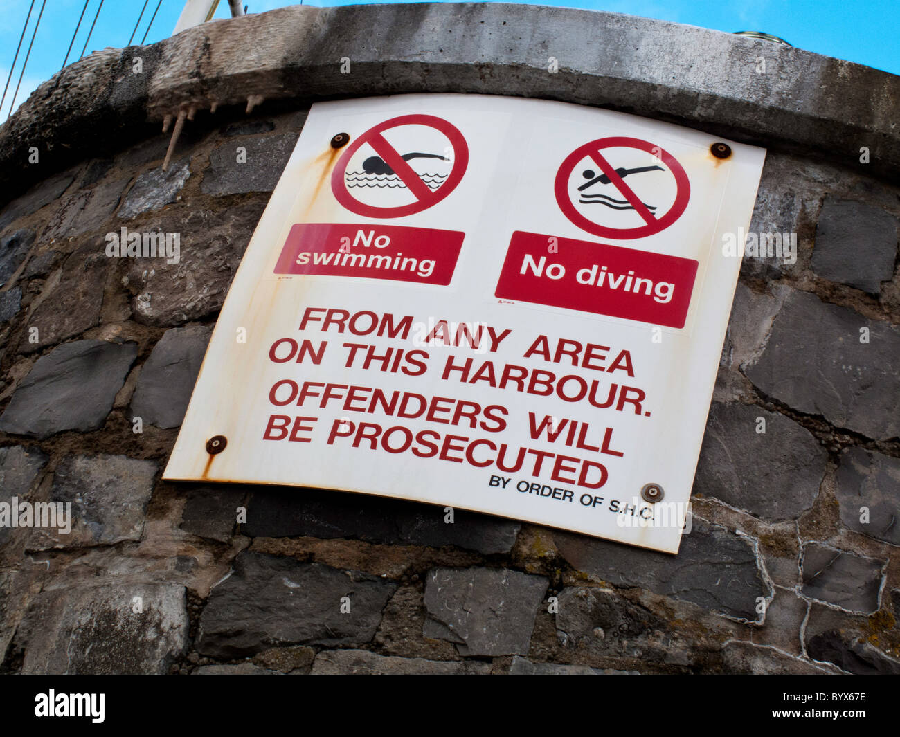 WARNING SIGNS ON SAUNDERSFOOT HARBOUR WALL, PEMBROKESHIRE WALES UK ...