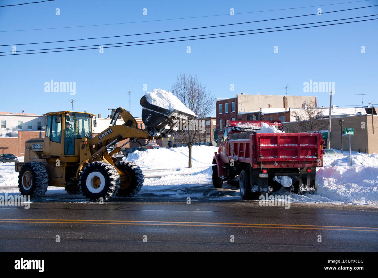 Front Loader and Dump Truck clearing snow from street after recent ...