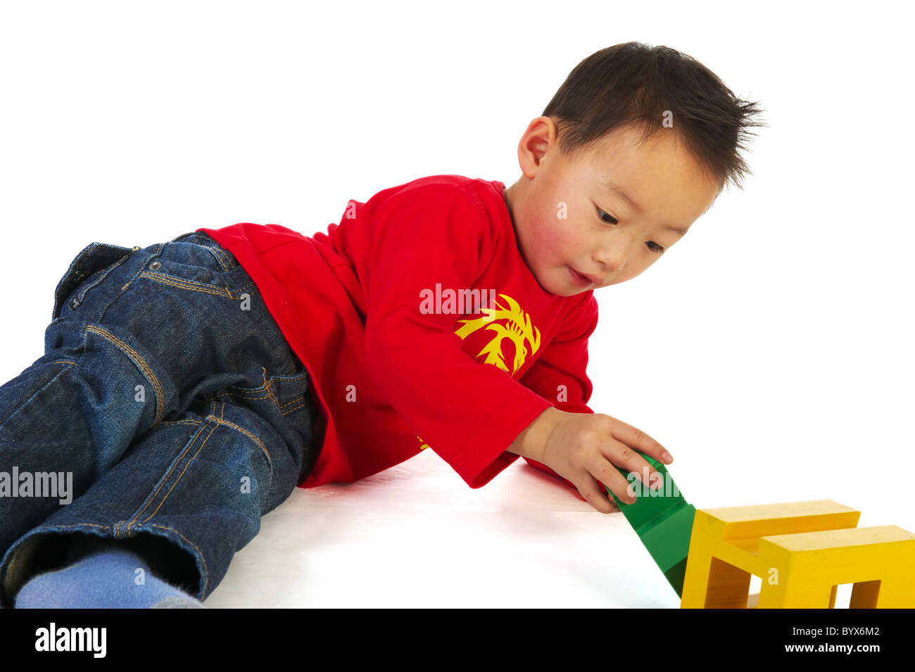 Little Chinese boys playing with wooden blocs Stock Photo - Alamy