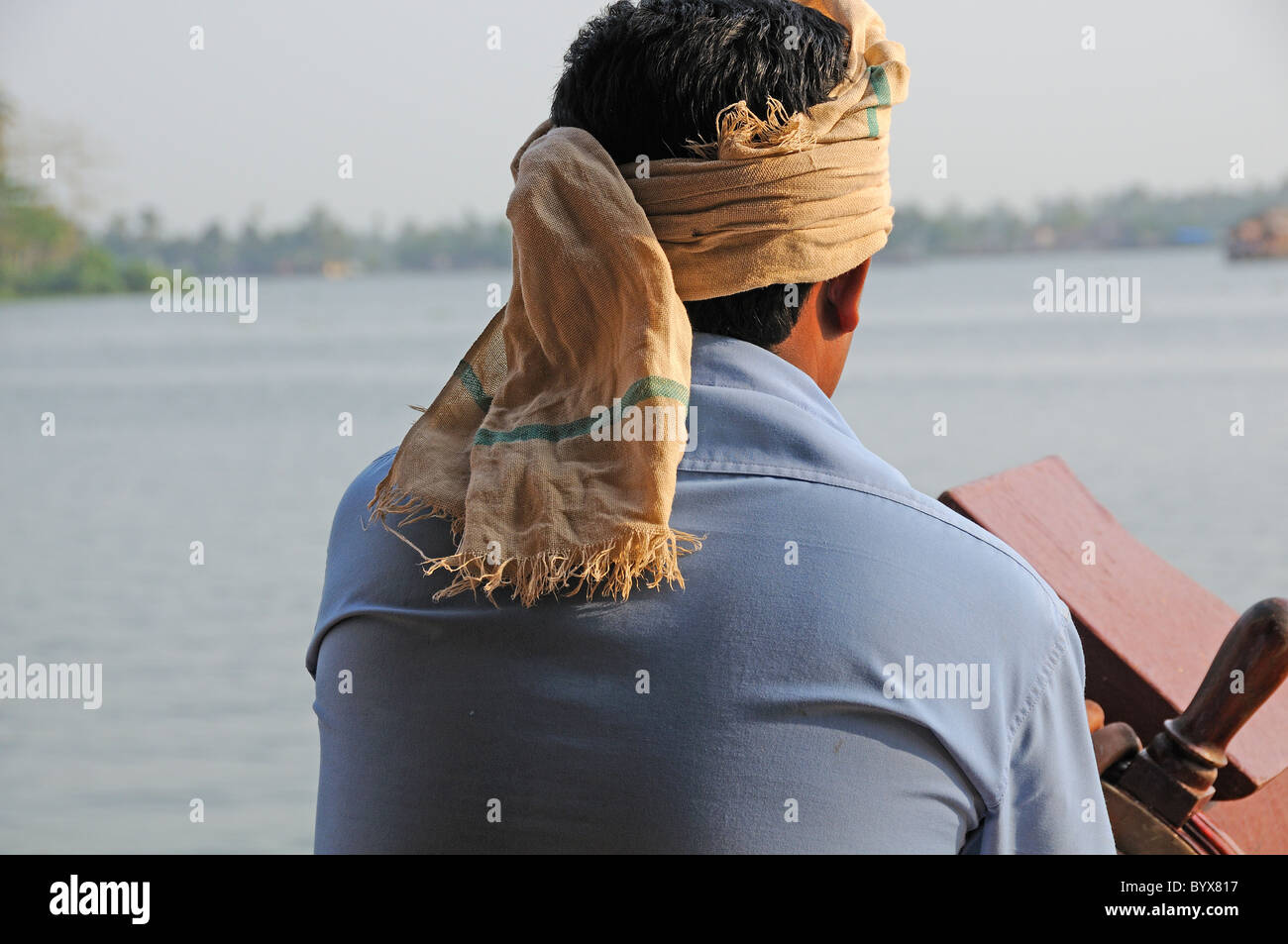 Houseboat on the Backwaters of Kerala being driven by the boat captain ...