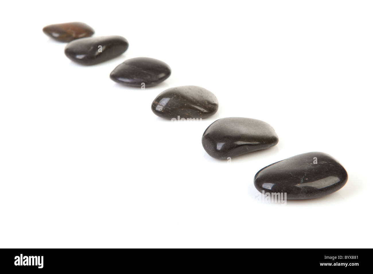 Black stepping stones in a row over white background Stock Photo - Alamy