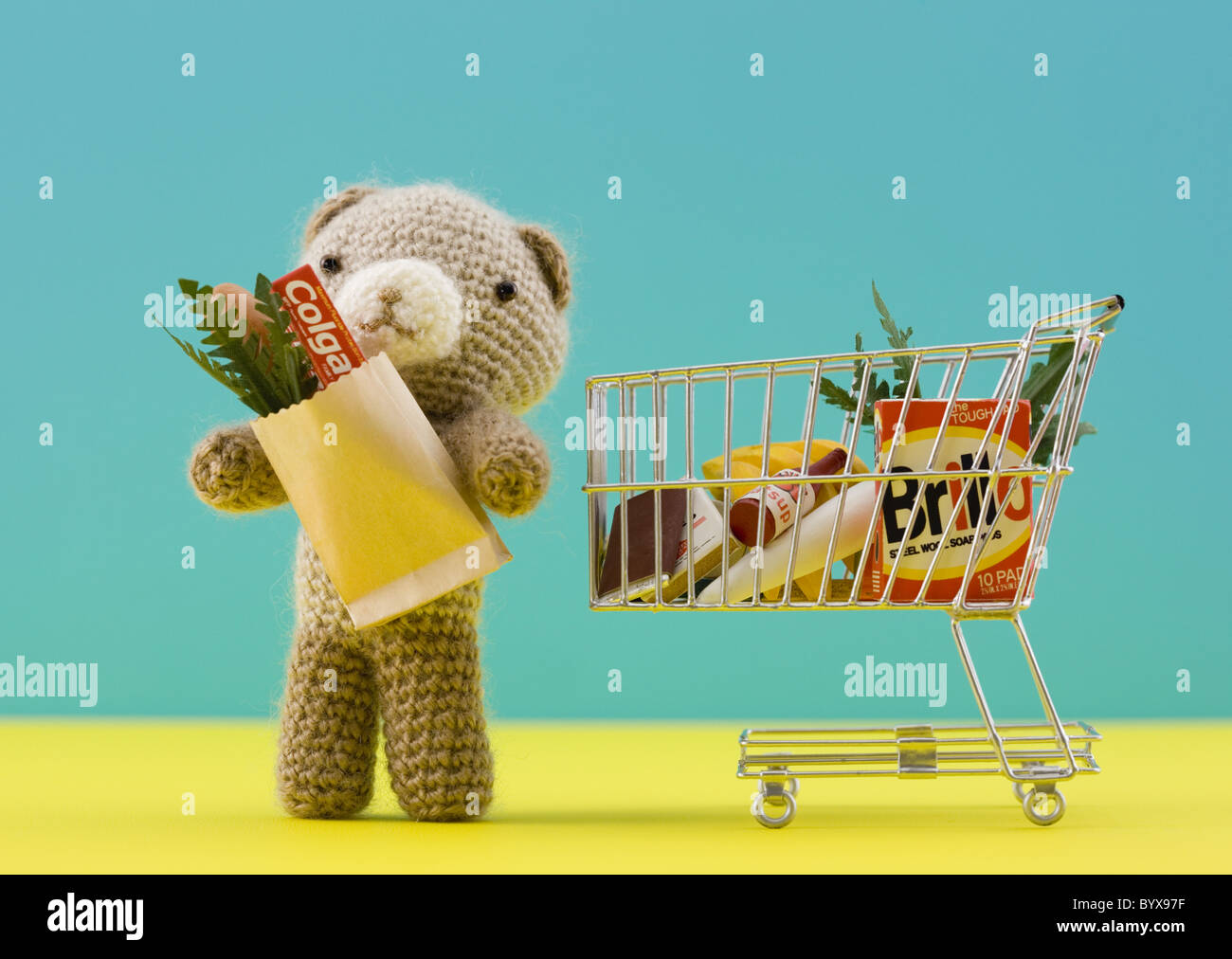Knitted teddy bear shopping Stock Photo - Alamy