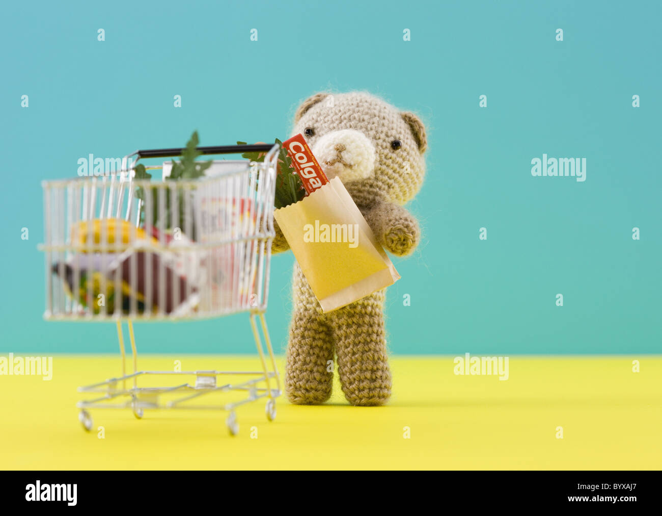 Knitted teddy bear shopping Stock Photo - Alamy