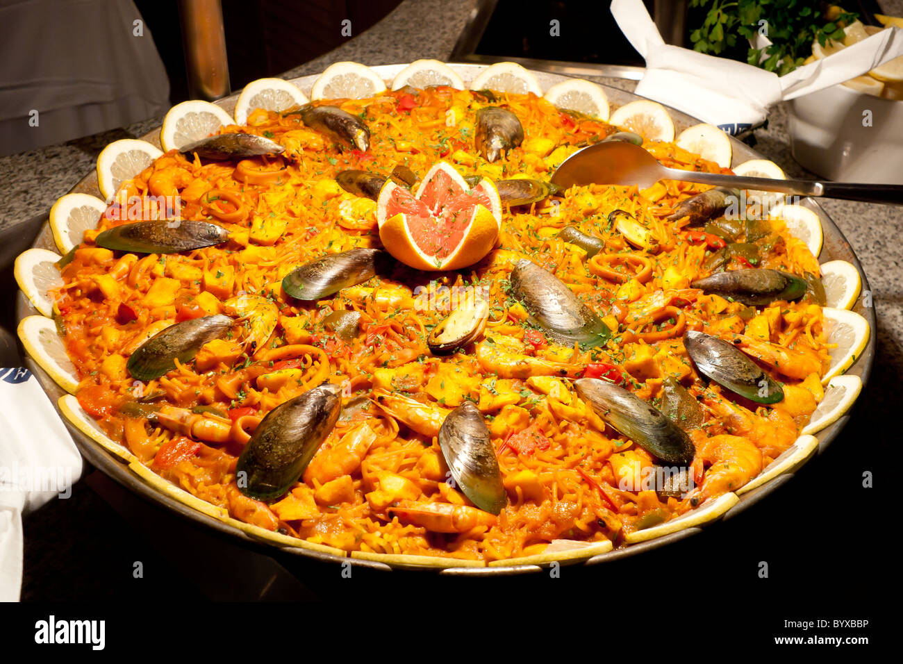 A large dish of sea food paella at a buffet dinner in a holiday hotel ...