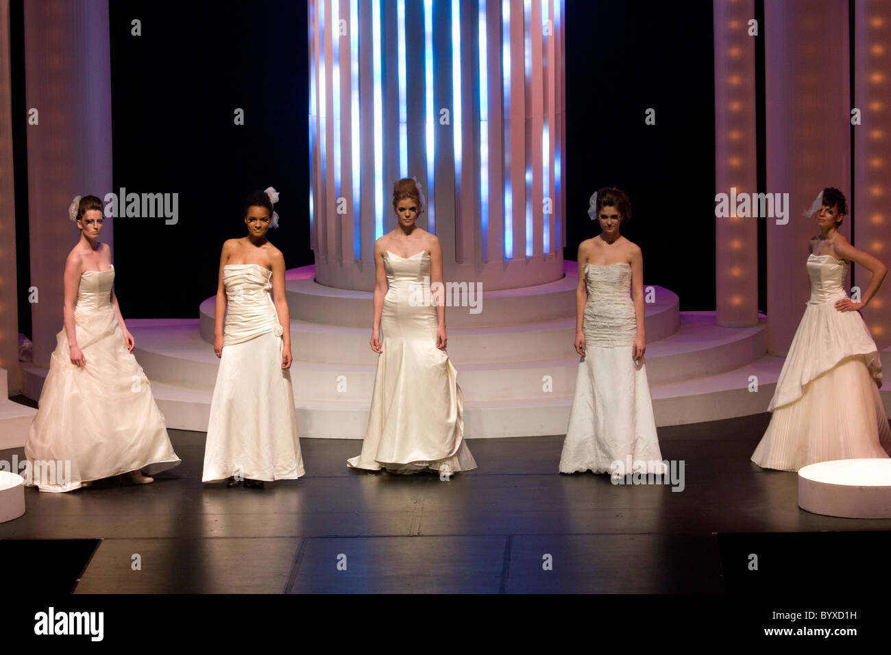 five woman white dress stage Stock Photo - Alamy
