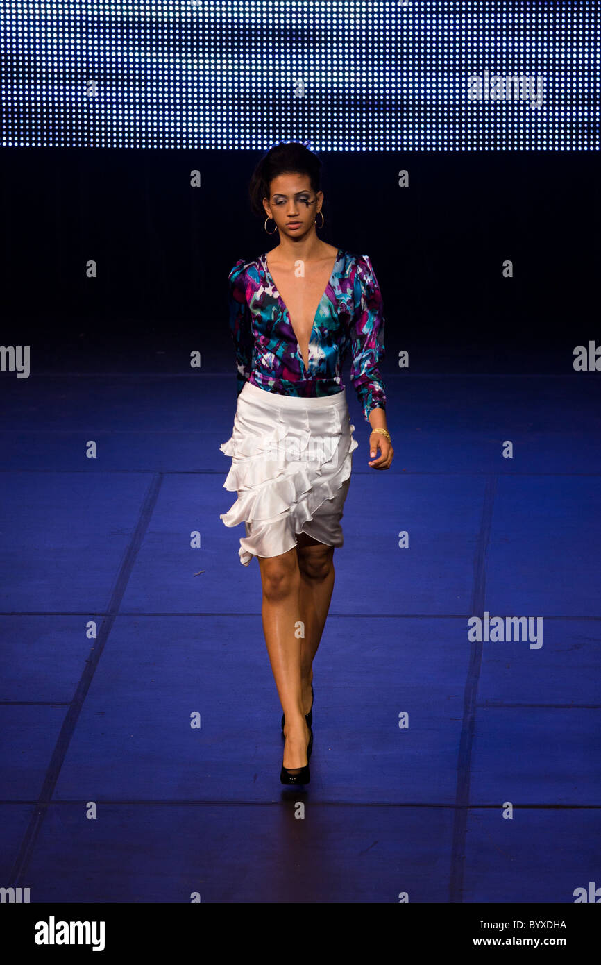 young woman walking catwalk blue Stock Photo - Alamy