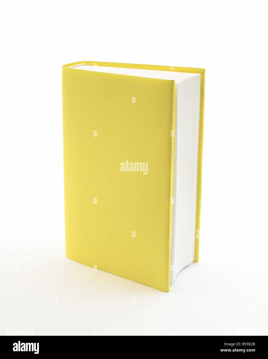Book with blank cover in yellow. On a white background with a little ...