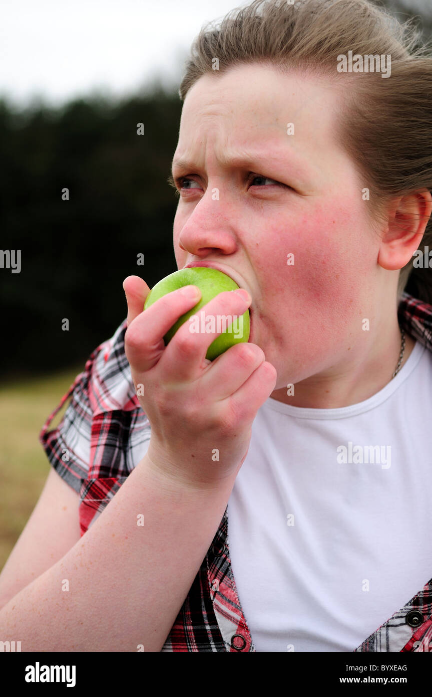 Teenager Eating Apple Stock Photo - Alamy