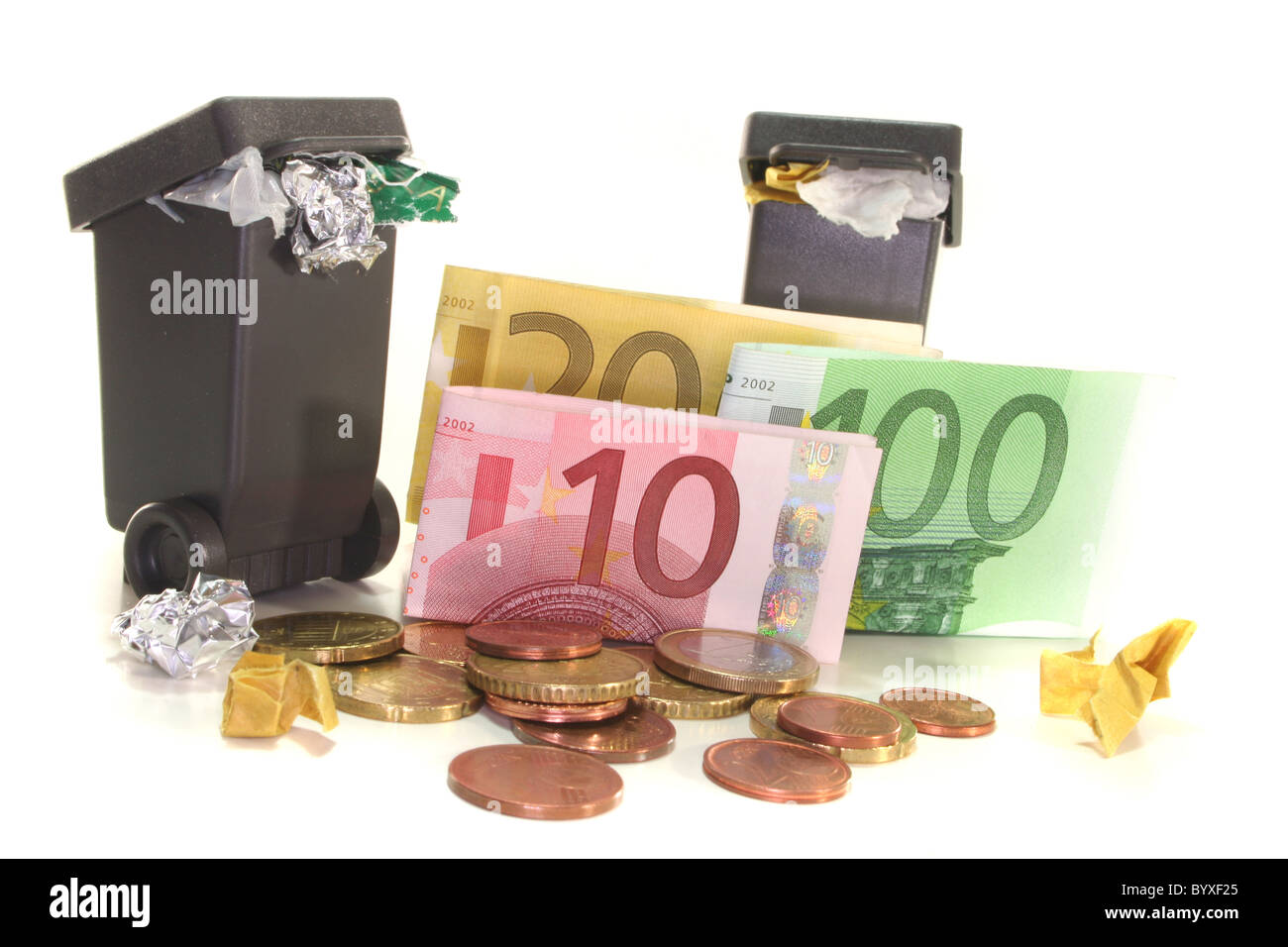 full garbage cans with Euro notes and Euro coins on white background ...