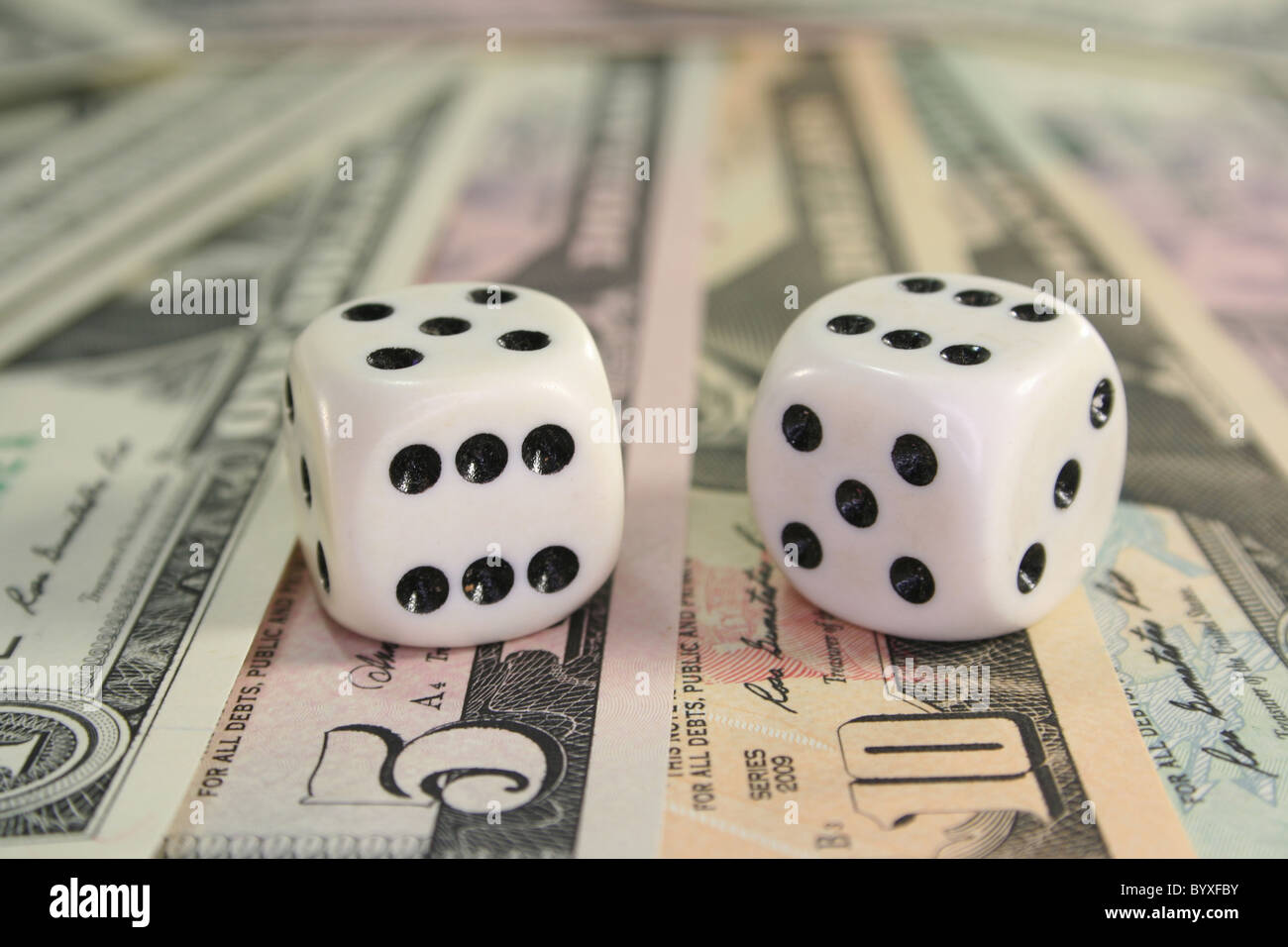 many dollar bills with fallen cubes with high scores Stock Photo - Alamy