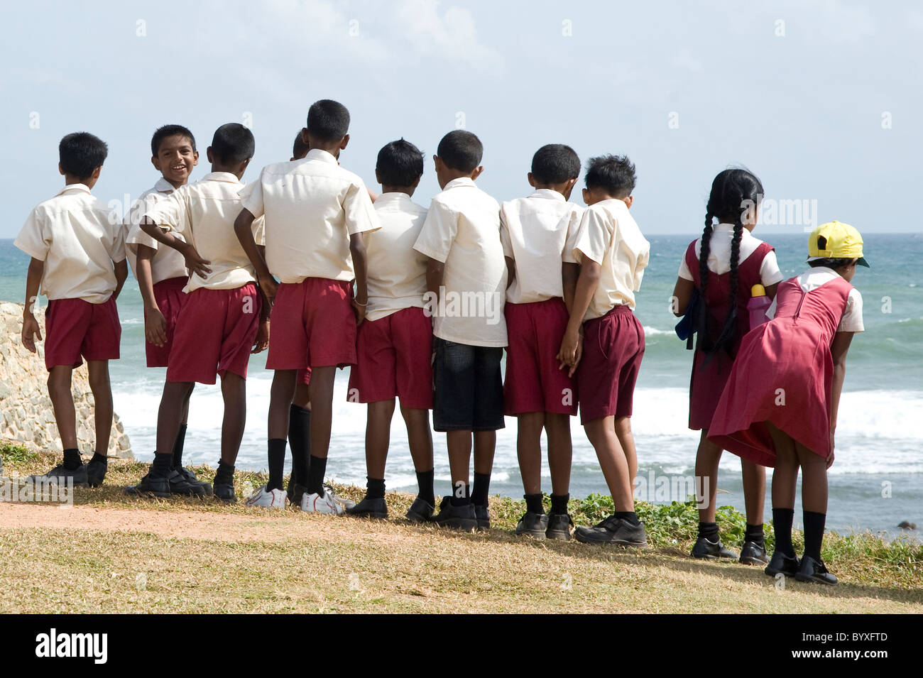 queue of school children on cliff Stock Photo - Alamy